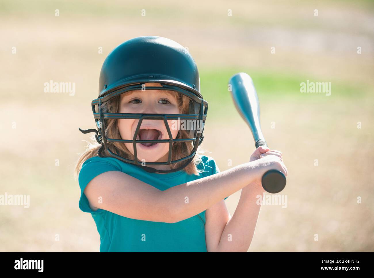 Funny kid up to bat at a baseball game. Close up portrait Stock Photo ...