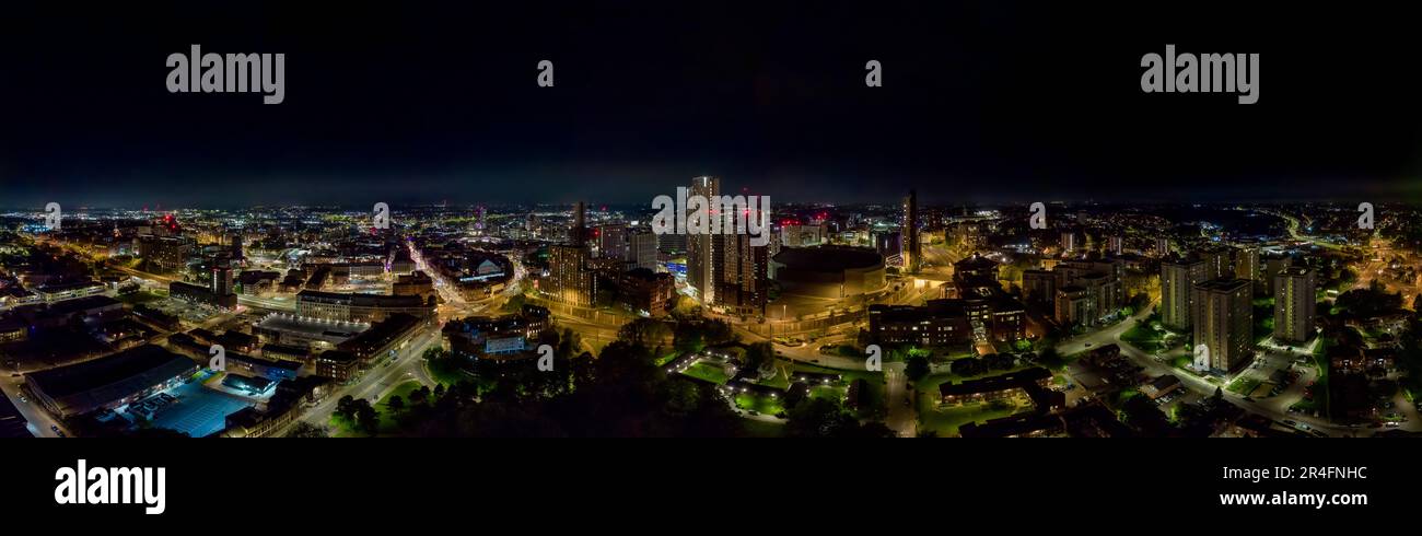 A mesmerizing view of Leeds city skyline illuminated at night, its tall ...