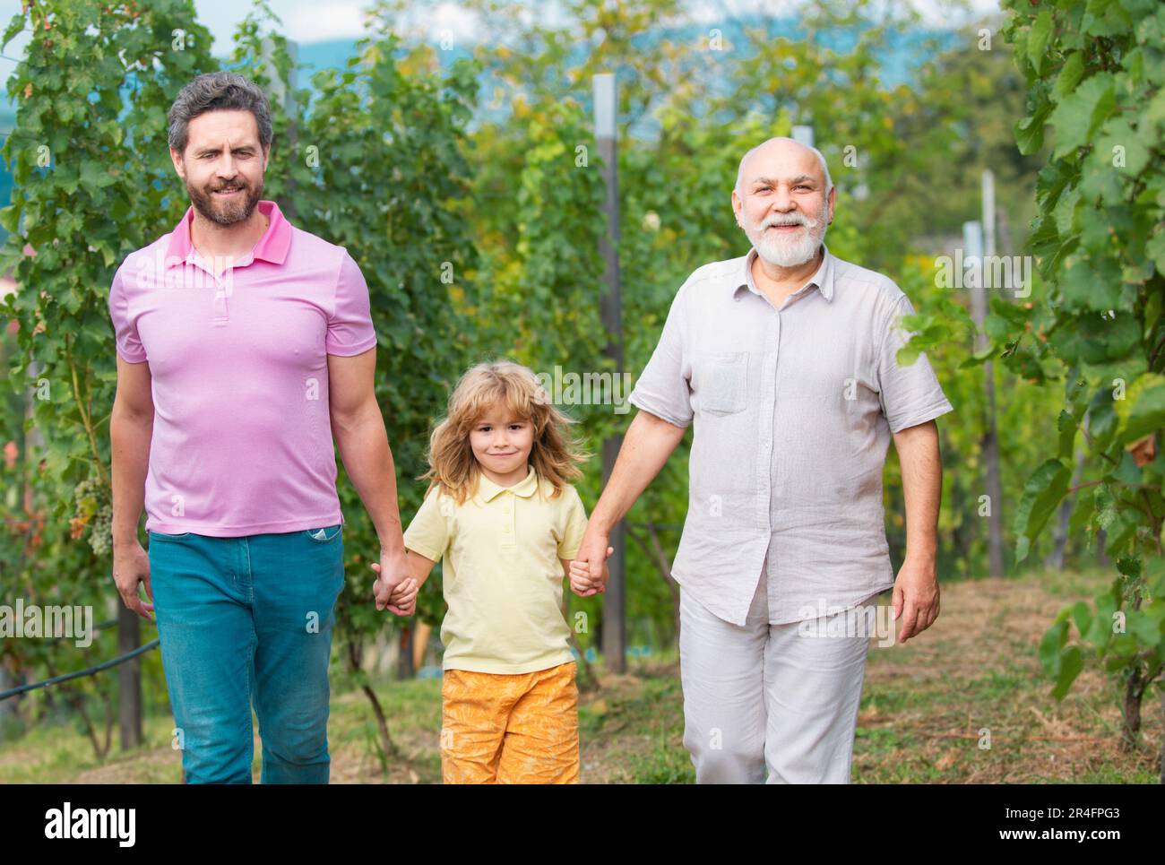 Male generation family walking together with three different ...