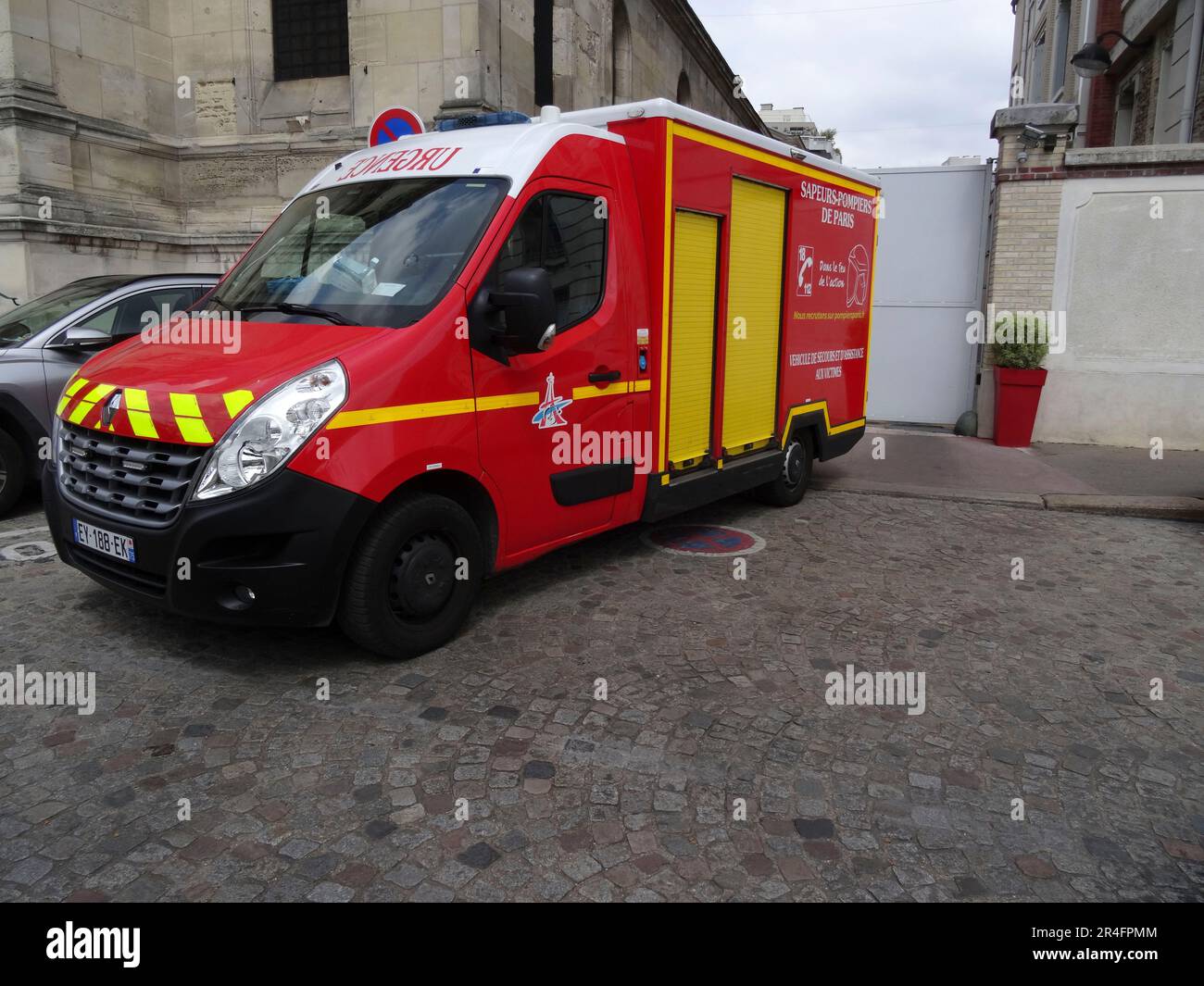 Red Paris emergency vehicle leaving home station, Paris, France, Europe ...