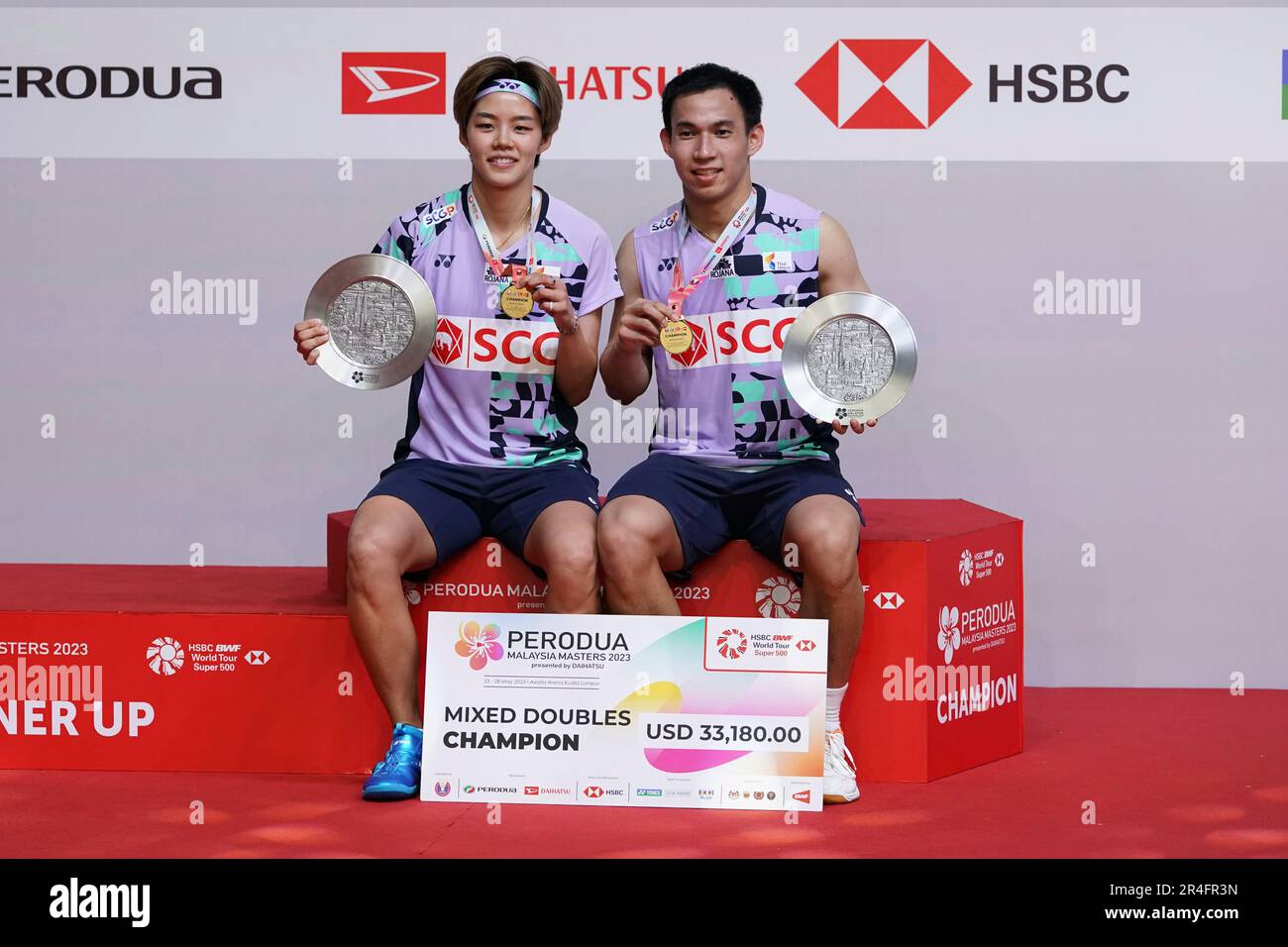 Thailand's Dechapol Puavaranukroh, right, and Sapsiree Taerattanachai pose for photo with their ...