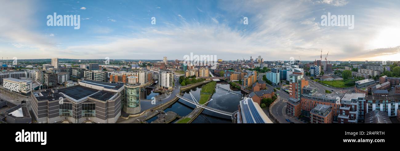 A mesmerizing view of Leeds city skyline illuminated at night, its tall ...