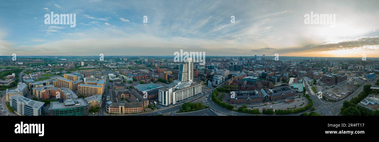 A mesmerizing view of Leeds city skyline illuminated at night, its tall ...