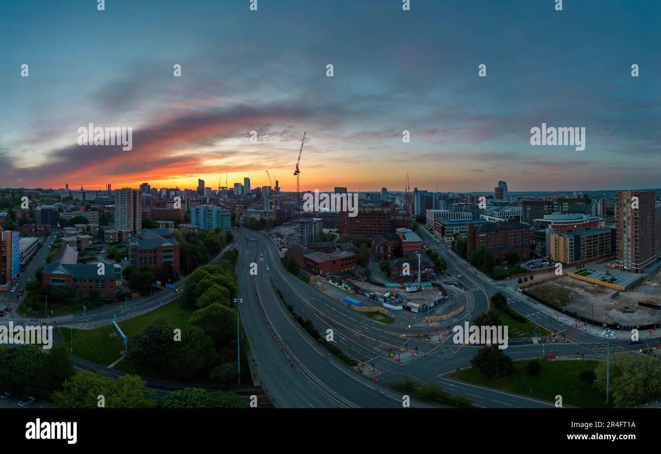 A mesmerizing view of Leeds city skyline illuminated at night, its tall ...