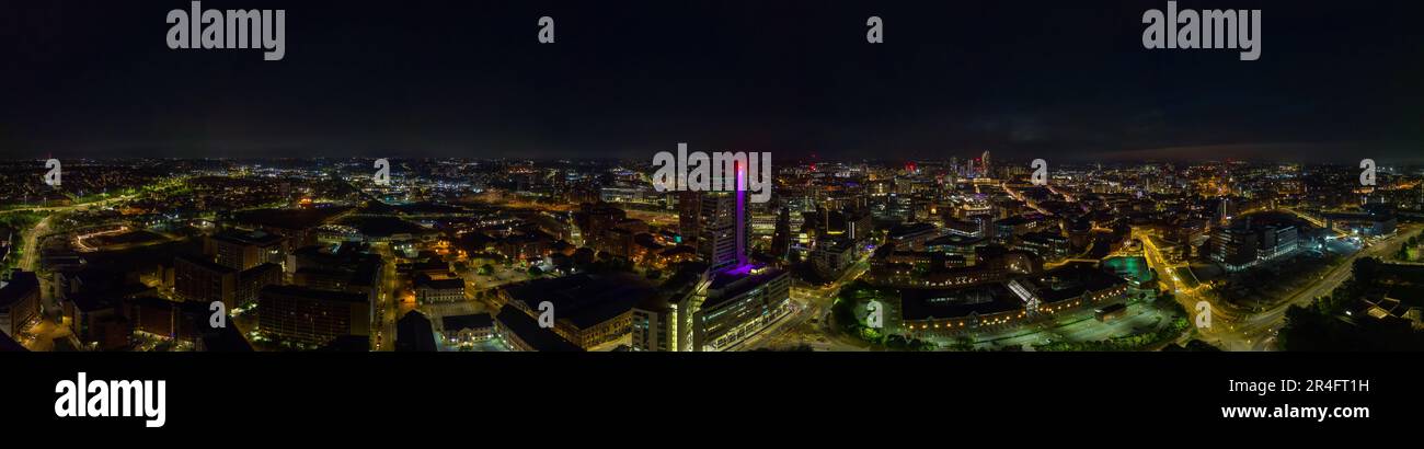 A mesmerizing view of Leeds city skyline illuminated at night, its tall ...
