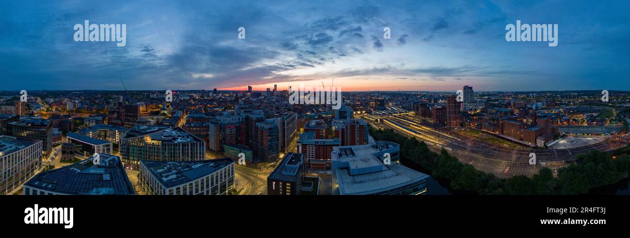 A mesmerizing view of Leeds city skyline illuminated at night, its tall ...