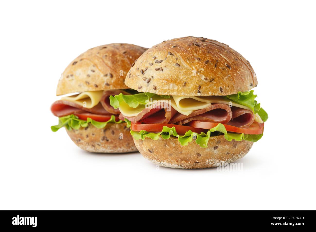 Sandwich with meat, cheese and vegetables isolated on a white ...
