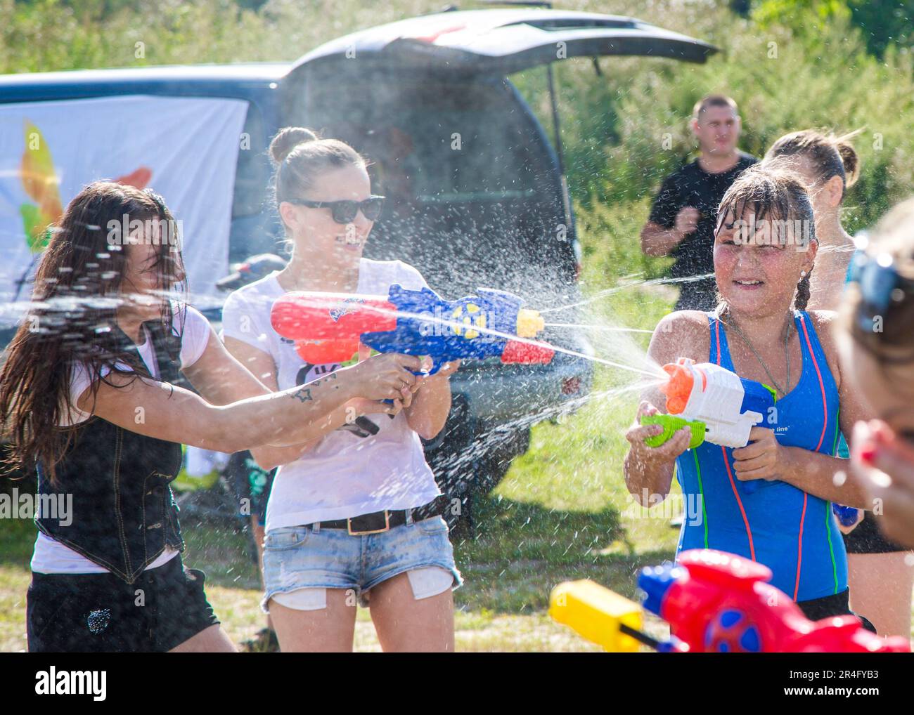 Children playing Water battle, water game battle Stock Photo - Alamy