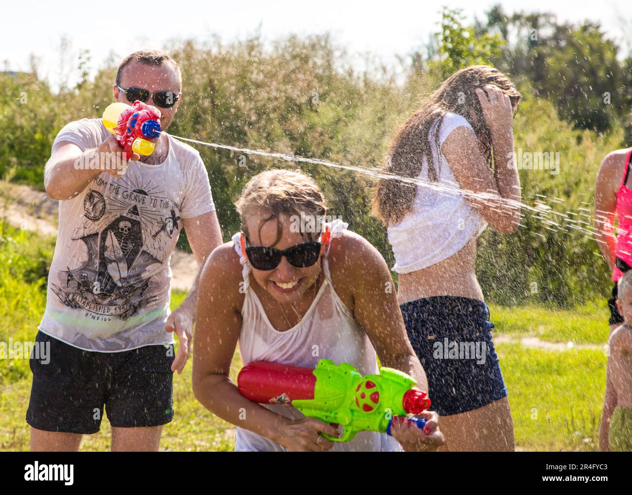 Children playing Water battle, water game battle Stock Photo - Alamy