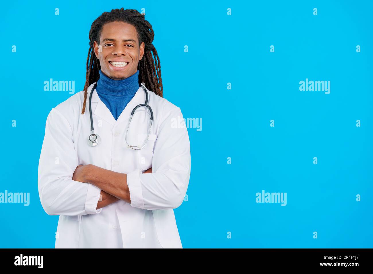 Doctor standing arms crossed in hi-res stock photography and images - Alamy