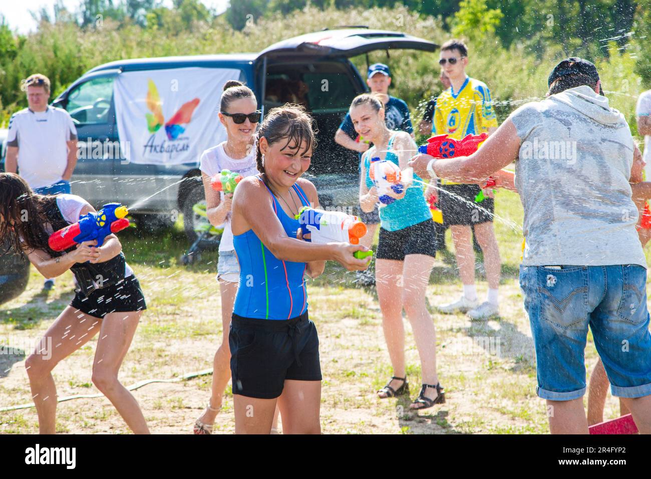 Children playing Water battle, water game battle Stock Photo - Alamy
