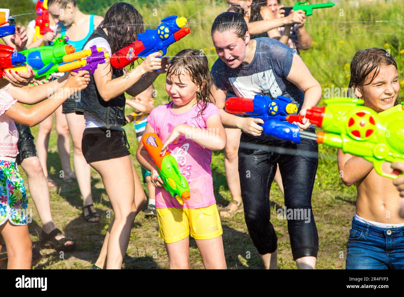 Children playing Water battle, water game battle Stock Photo - Alamy