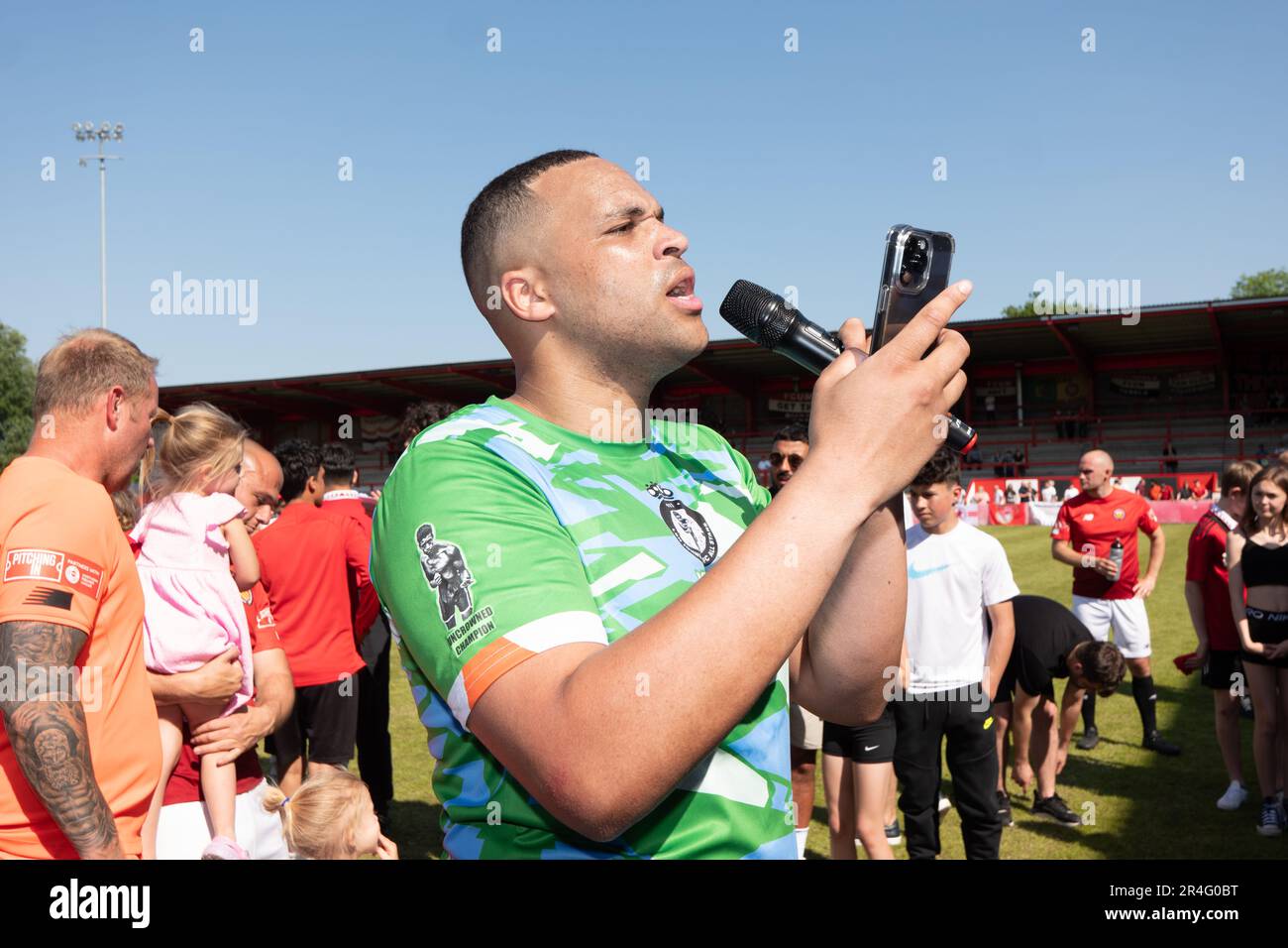 Manchester, UK. 27th May 2023. Actor Lamin Touray addresses crowd about ...