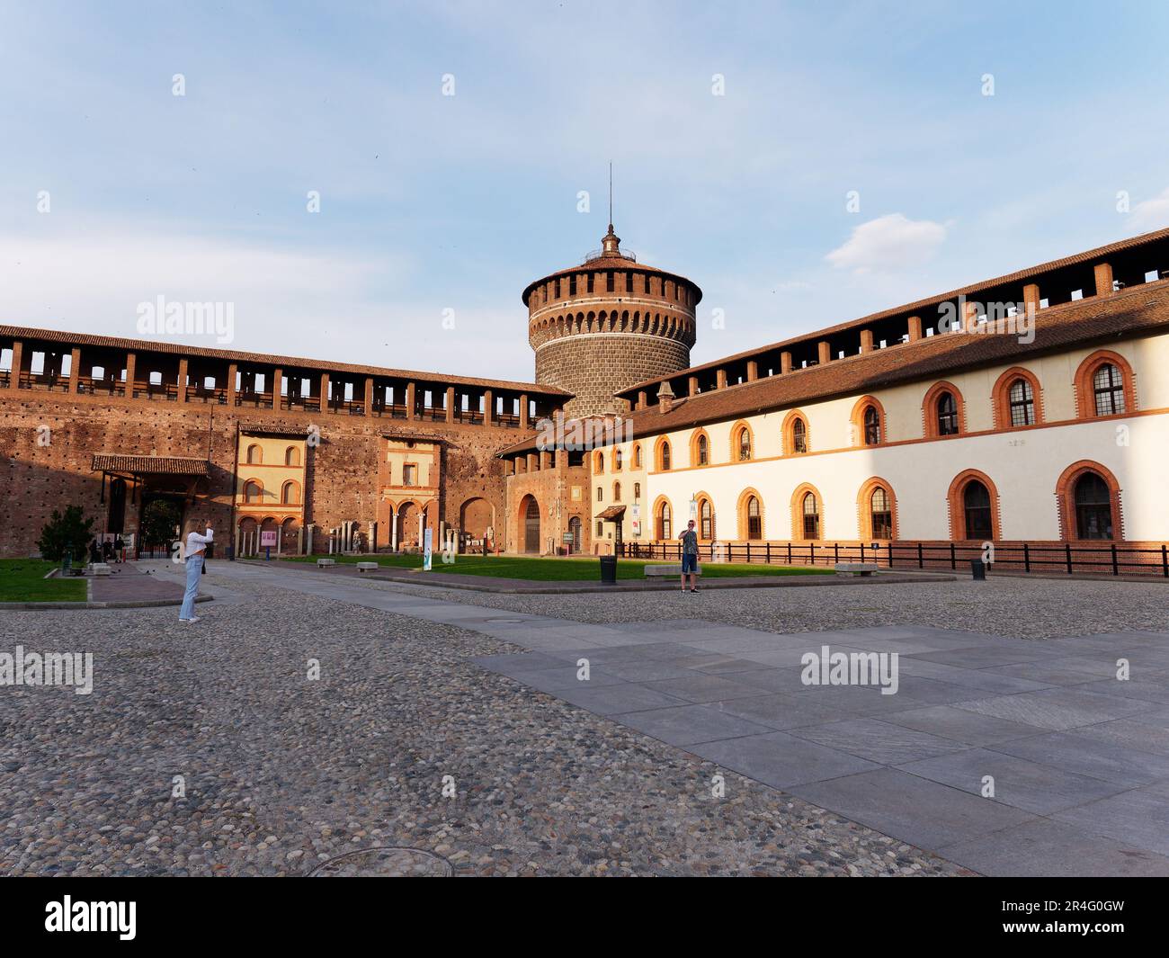 Sforzesco Castle and courtyard with tourists sightseeing in the City of ...