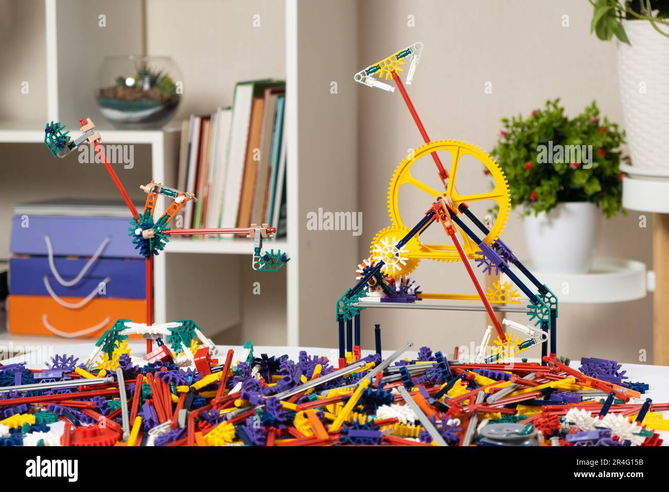 Children's constructor of gears cogwheel and sticks in the children's ...