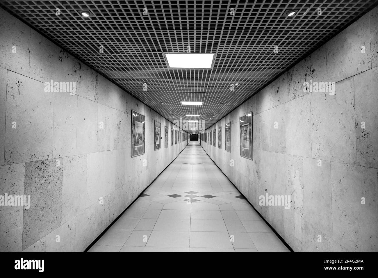 A long corridor with marble walls and photographs Stock Photo - Alamy
