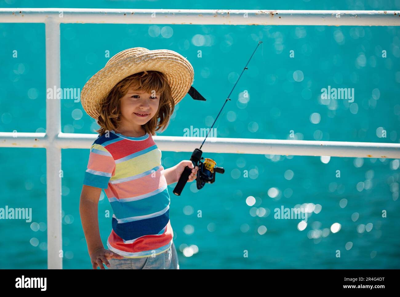 Kids fishing. Child fishing on the lake. Young fisher. Boy with spinner ...