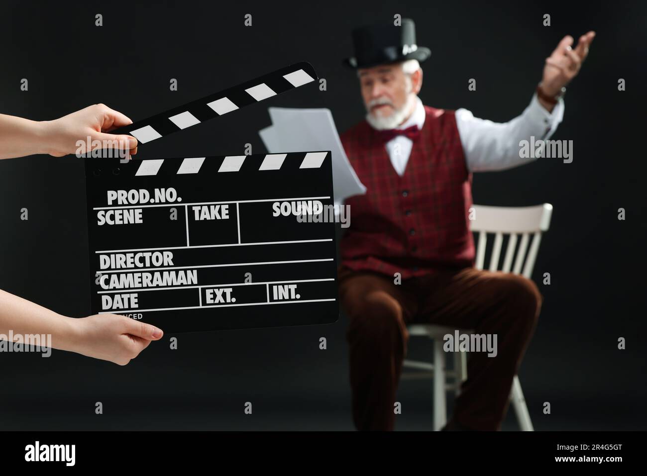 Senior actor performing role while second assistant camera holding ...