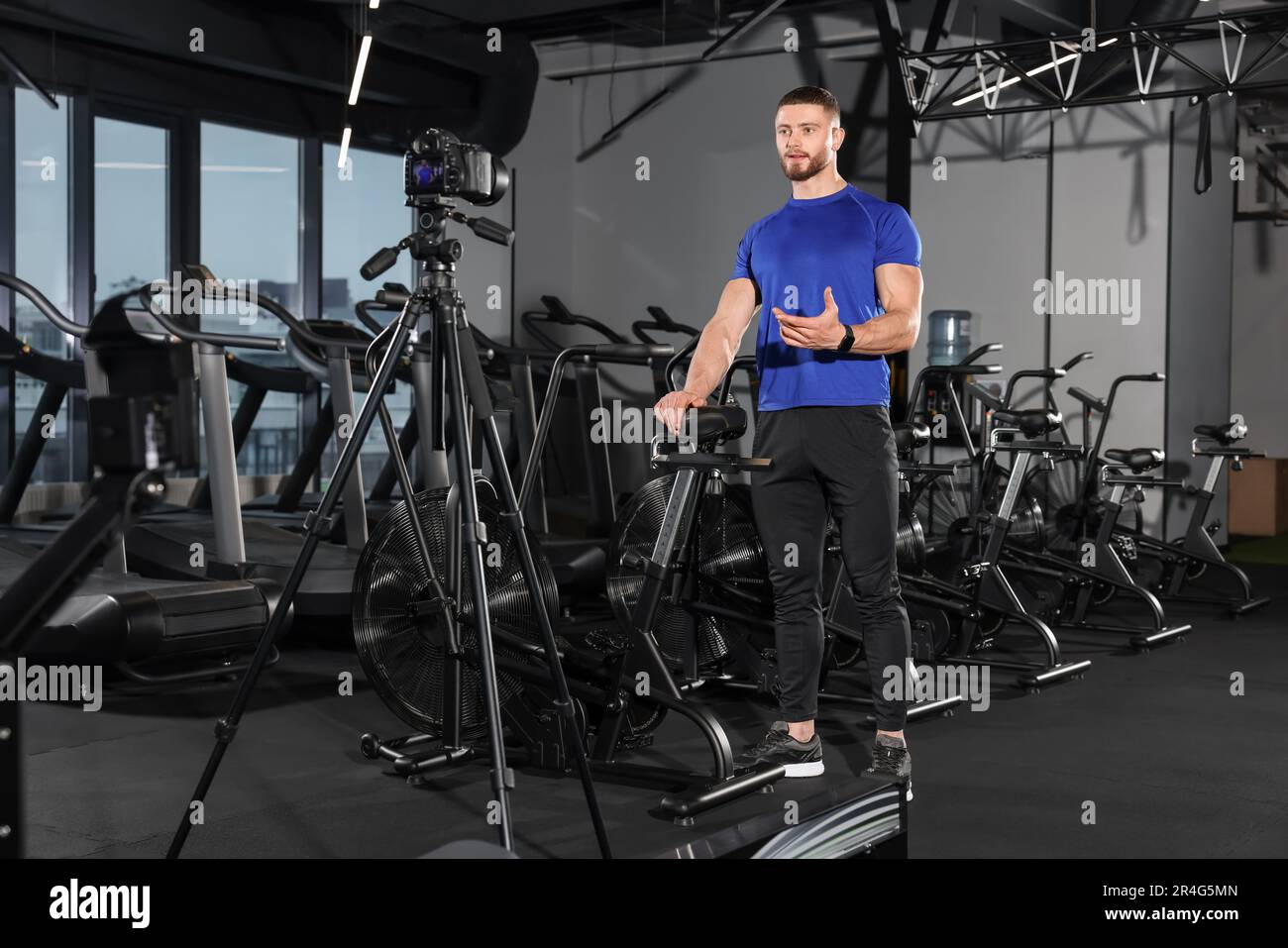 Man recording online training on camera at gym. Fitness coach Stock ...
