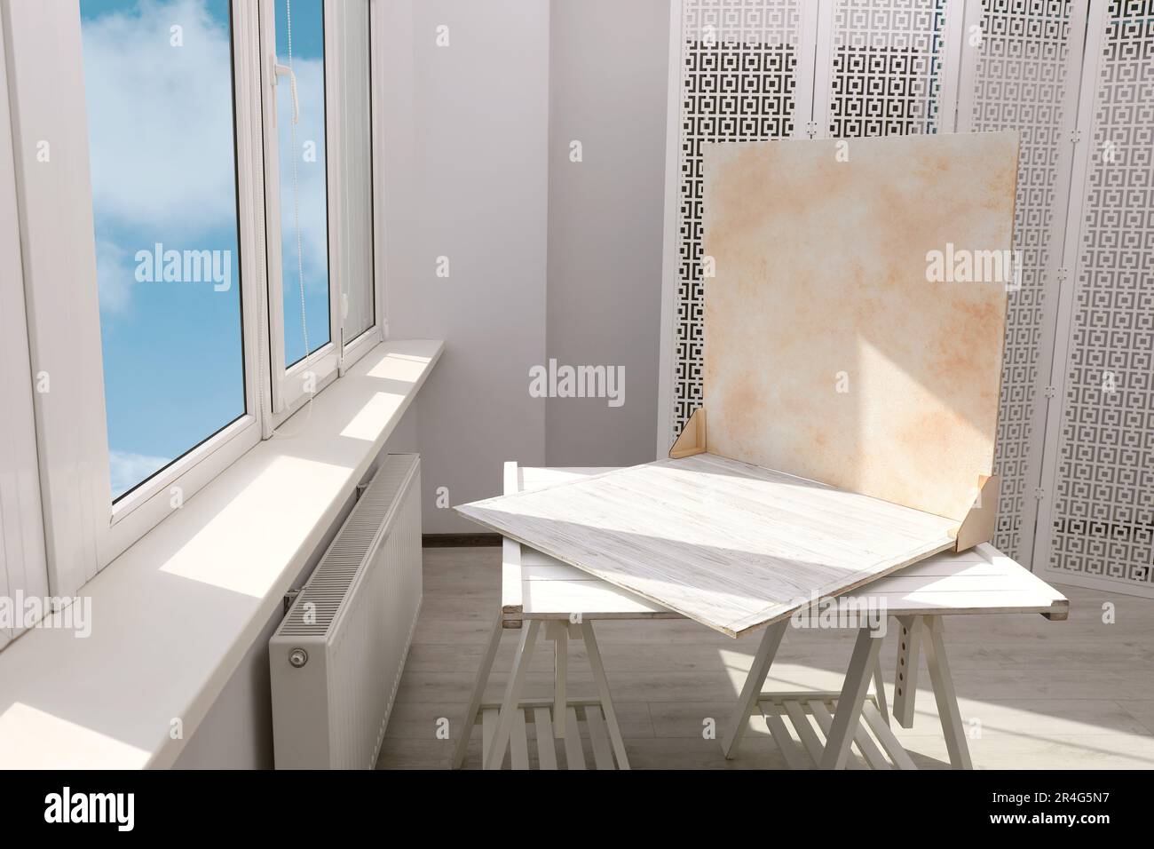 Double-sided backdrop on table in photo studio Stock Photo - Alamy
