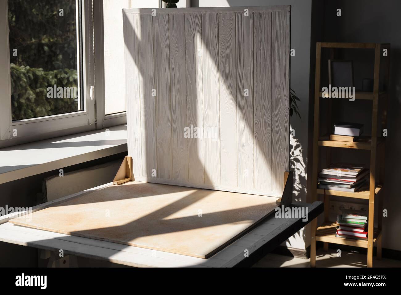 Double-sided backdrop on table in photo studio Stock Photo - Alamy