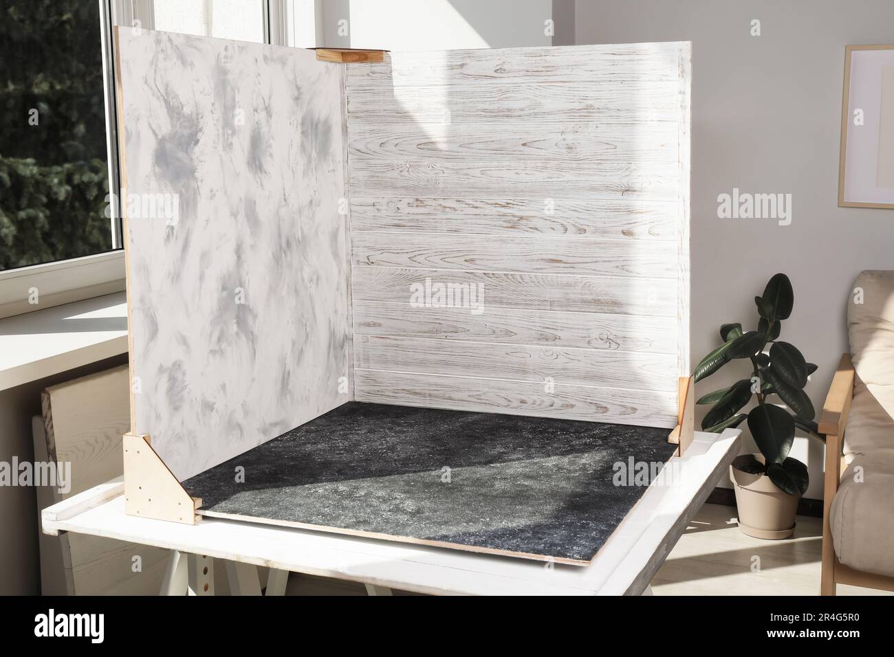 Double-sided backdrops on table in photo studio Stock Photo - Alamy