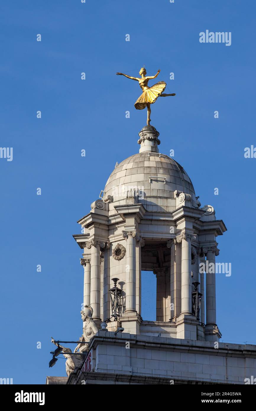 Replica gilded statue of Anna Pavlova classical ballerina on the cupola of the Victoria Palace ...