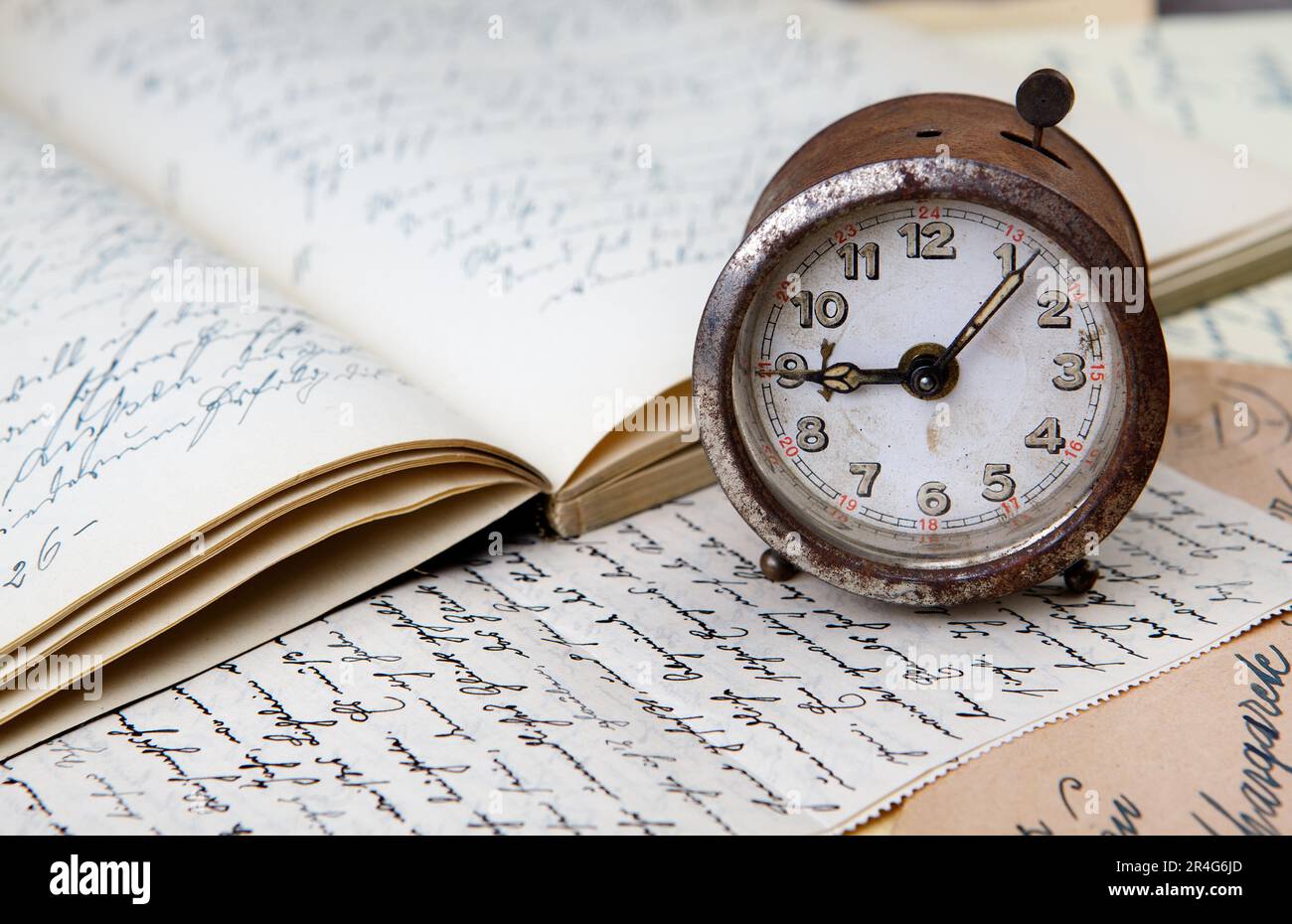 Old rusty mechanical alarm clocks and handwritten letters Stock Photo ...