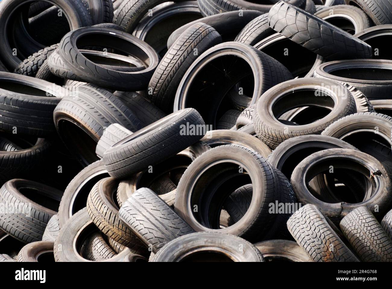 A waste heap of old tyres for rubber recycling Stock Photo - Alamy