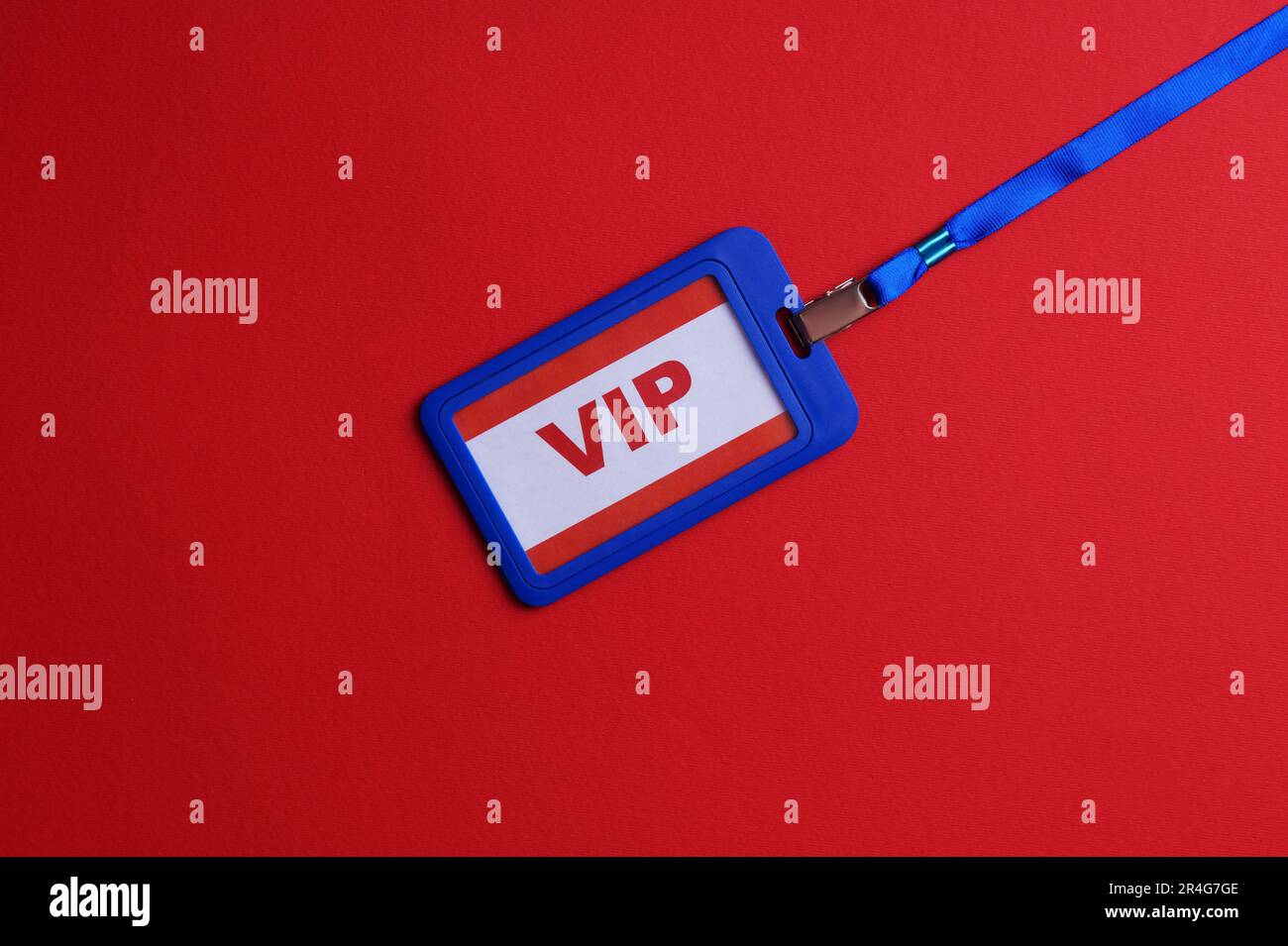 Plastic vip badge on red background, top view Stock Photo - Alamy