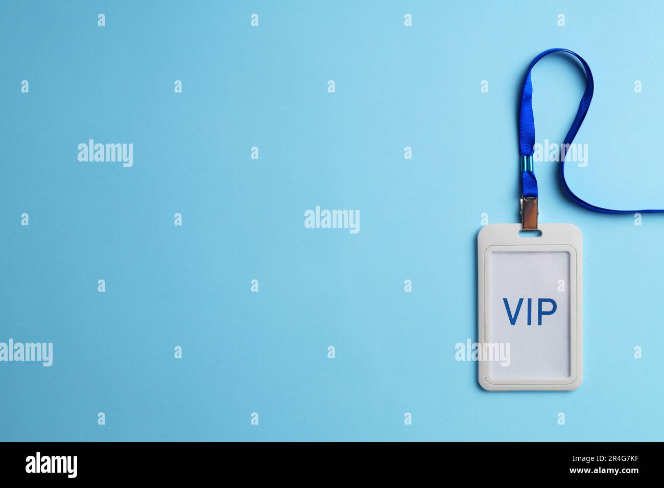 Plastic vip badge on light blue background, top view. Space for text ...