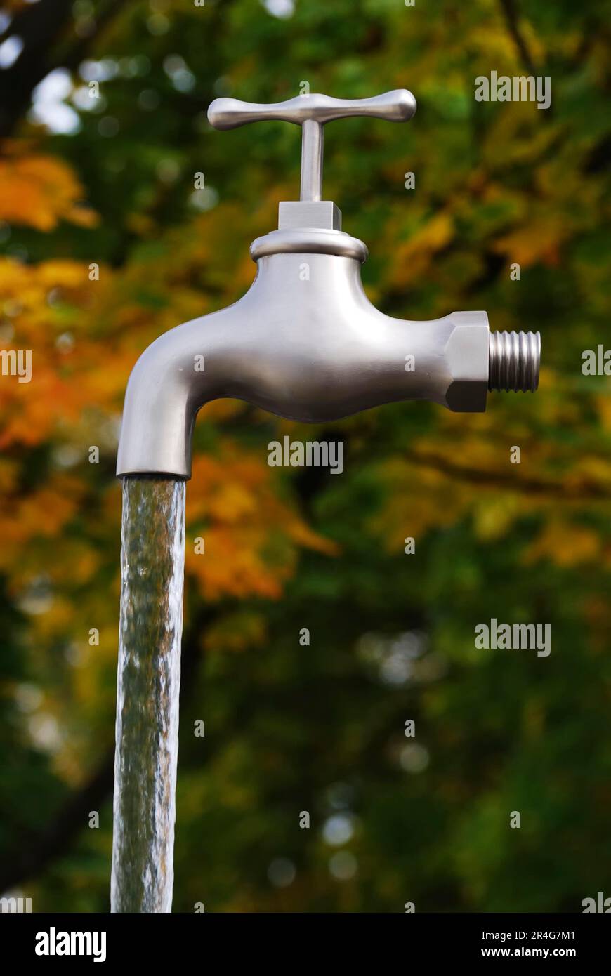 Illusion with a magic faucet and flowing water Stock Photo - Alamy