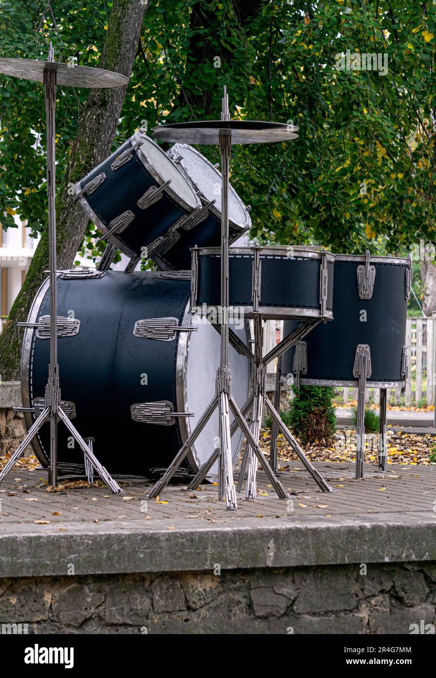 Drum set. Percussion musical instruments on a city street close-up ...