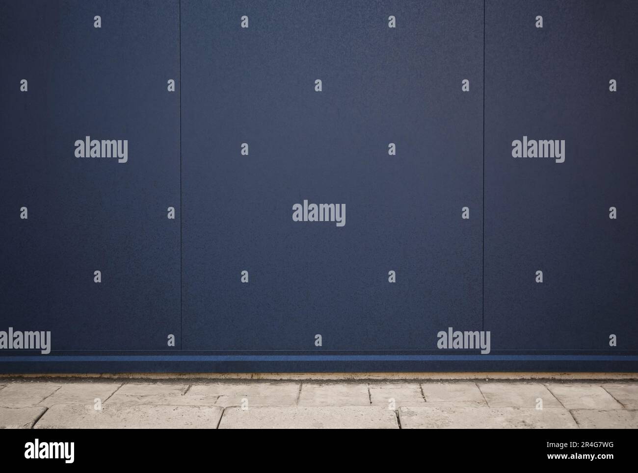 View on urban concrete wall and pavement Stock Photo - Alamy