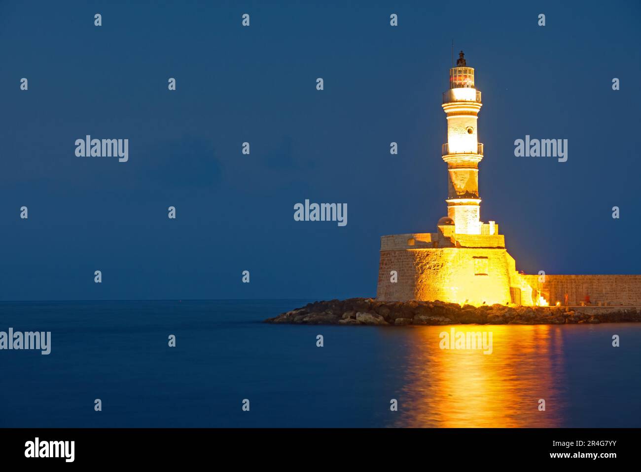 The lighthouse of Chania in Crete by night Stock Photo - Alamy