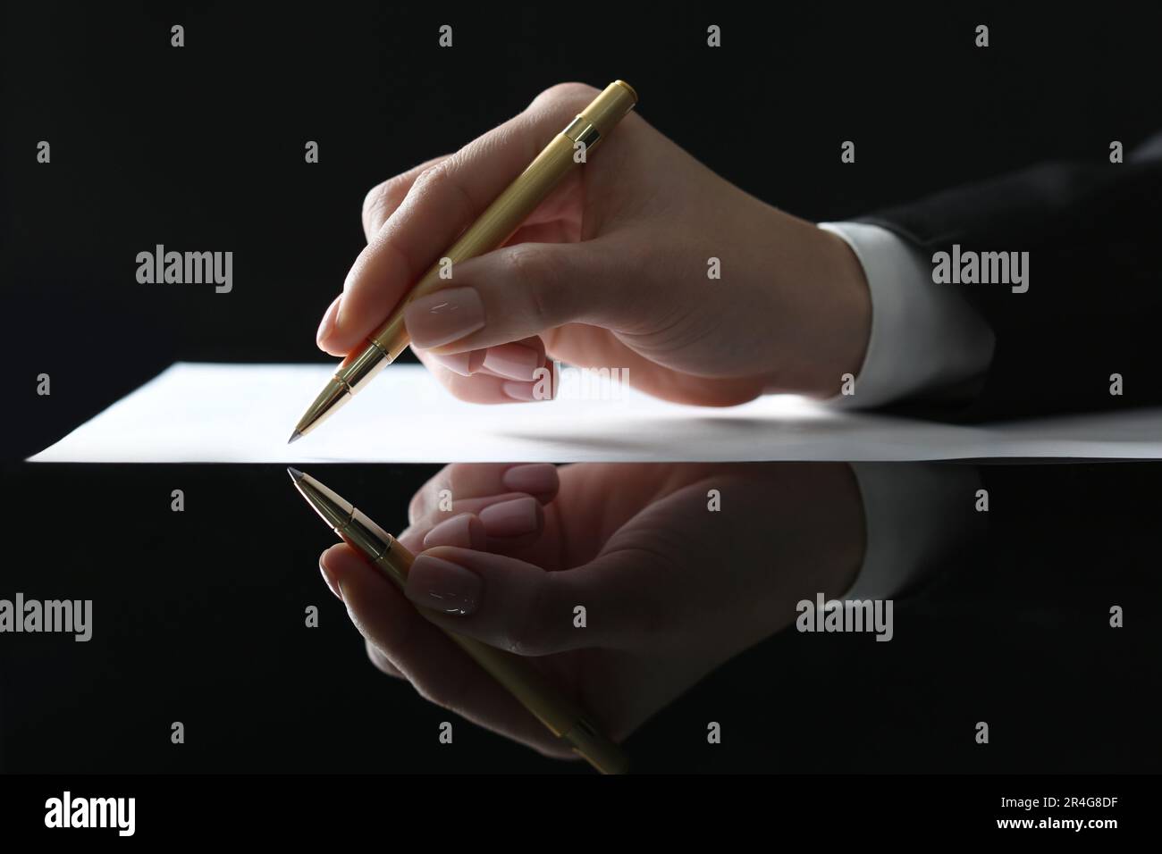Businesswoman writing on sheet hi-res stock photography and images - Alamy