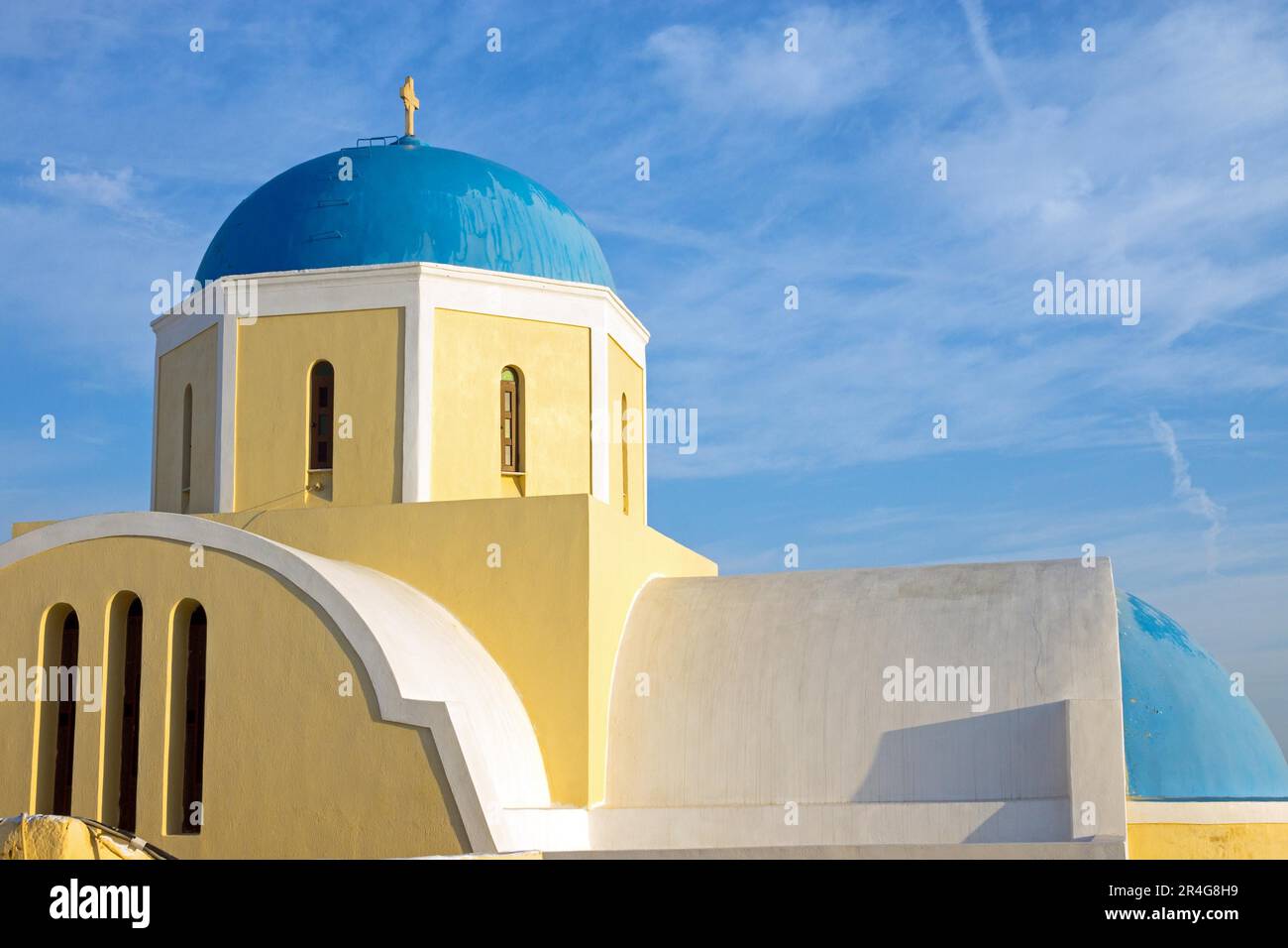 Yellow church with blue dome, seen in Oia on Santorini Stock Photo - Alamy
