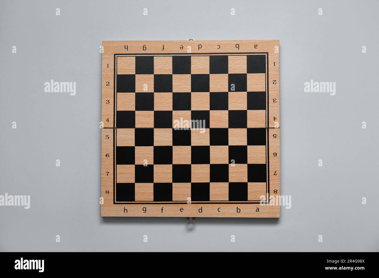 Empty wooden checkerboard on light grey background, top view Stock ...