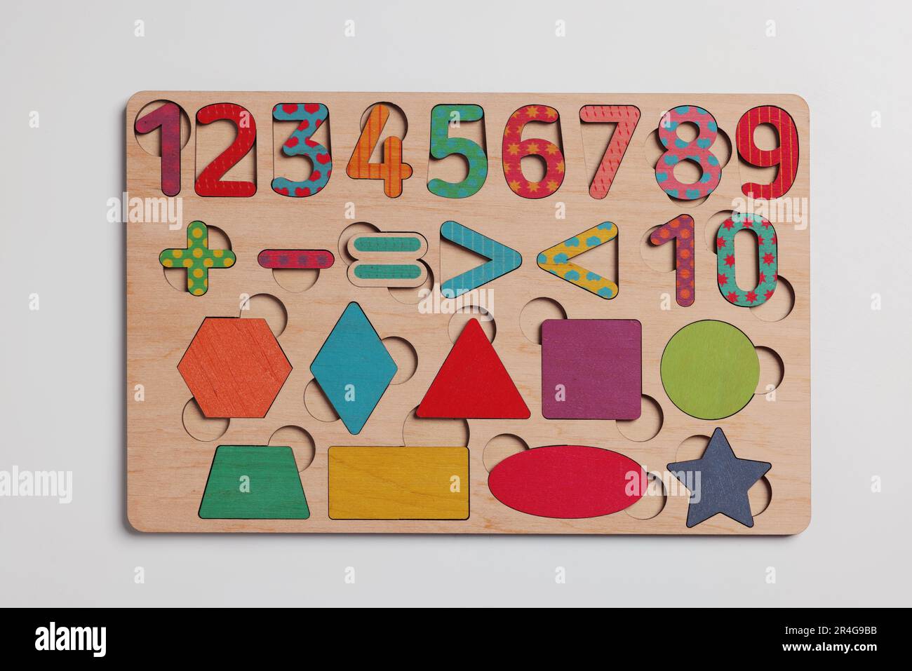 Wooden math game kit for children on white table, top view Stock Photo ...