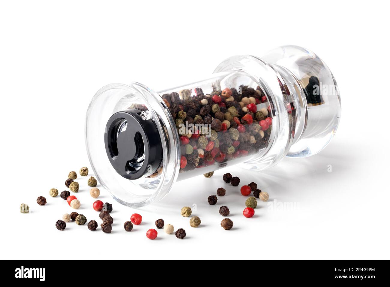 Colored Peppers Mix and pepper grinder on white background Stock Photo ...