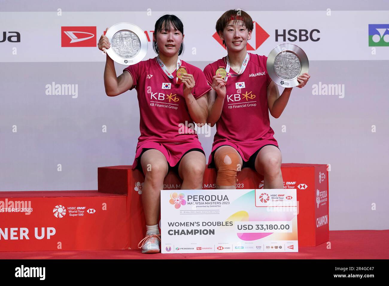 South Korea's Lee So Hee, right and Baek Ha Na pose with their medals on the podium after ...