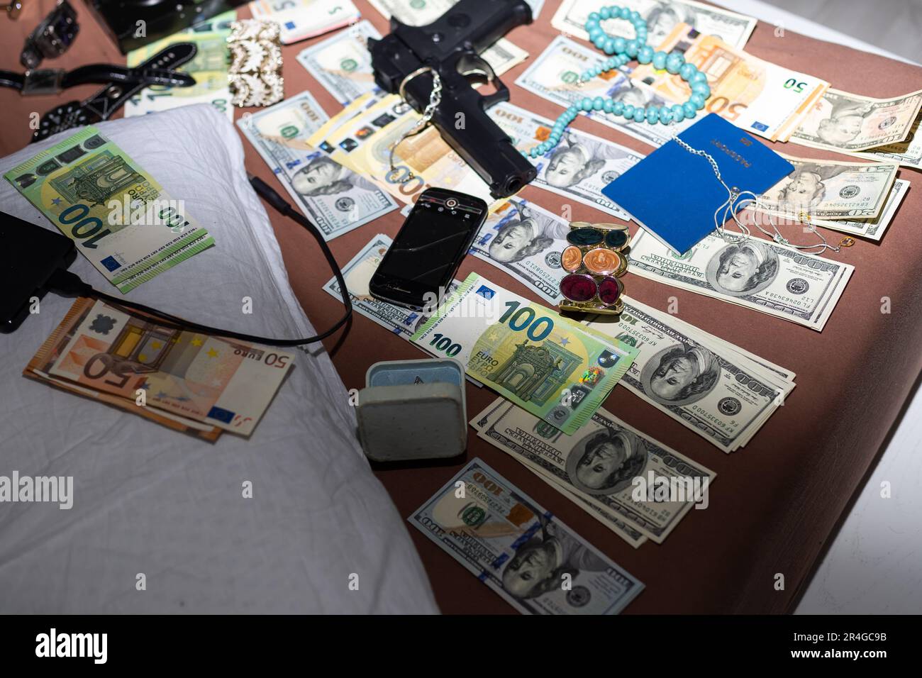 Evidence bag next to dollar banknotes in a crime investigation unit ...