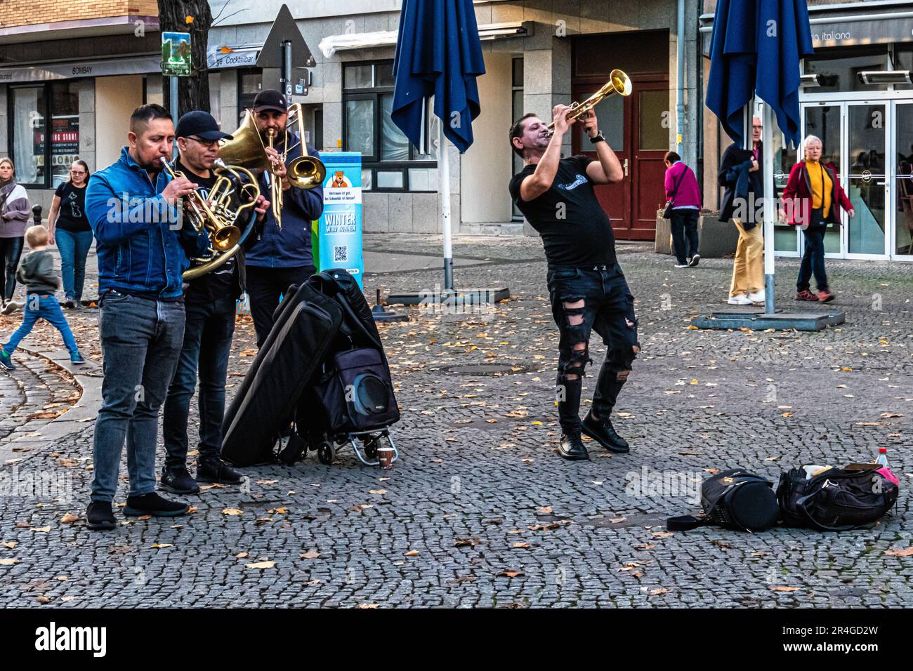 Street musicians entertaining & playing brass musical instruments, Alt ...