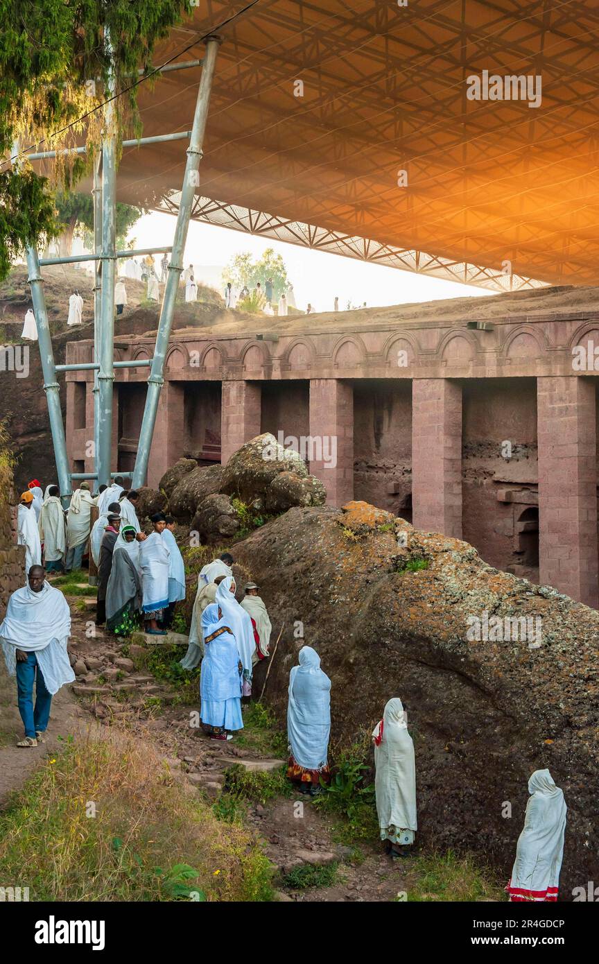 Pilgrims, rock church, traditional dress, white cloaks, ceremony, rock ...