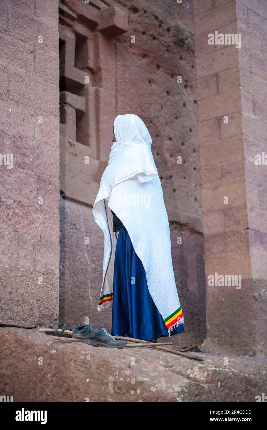 Pilgrims, rock church, traditional dress, white cloak, ceremony, rock ...