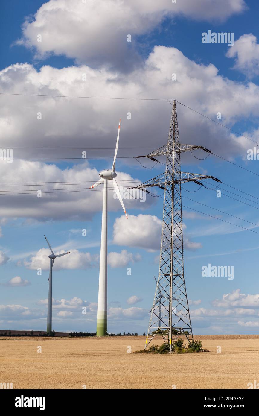 Wind turbines with overhead line Stock Photo - Alamy