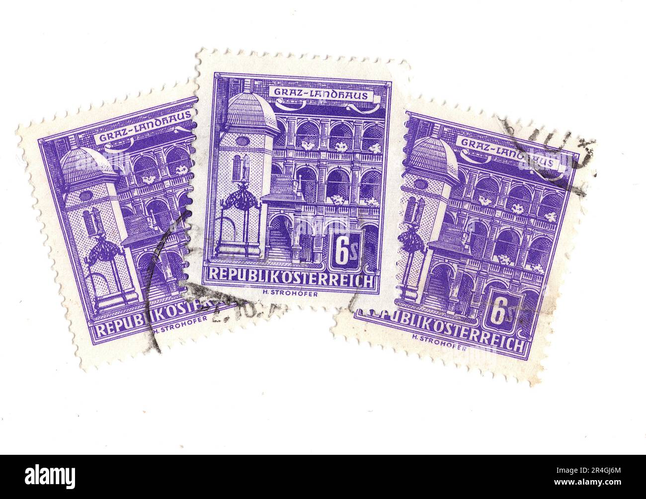 Purple vintage postage stamps from Austria isolated on a white ...