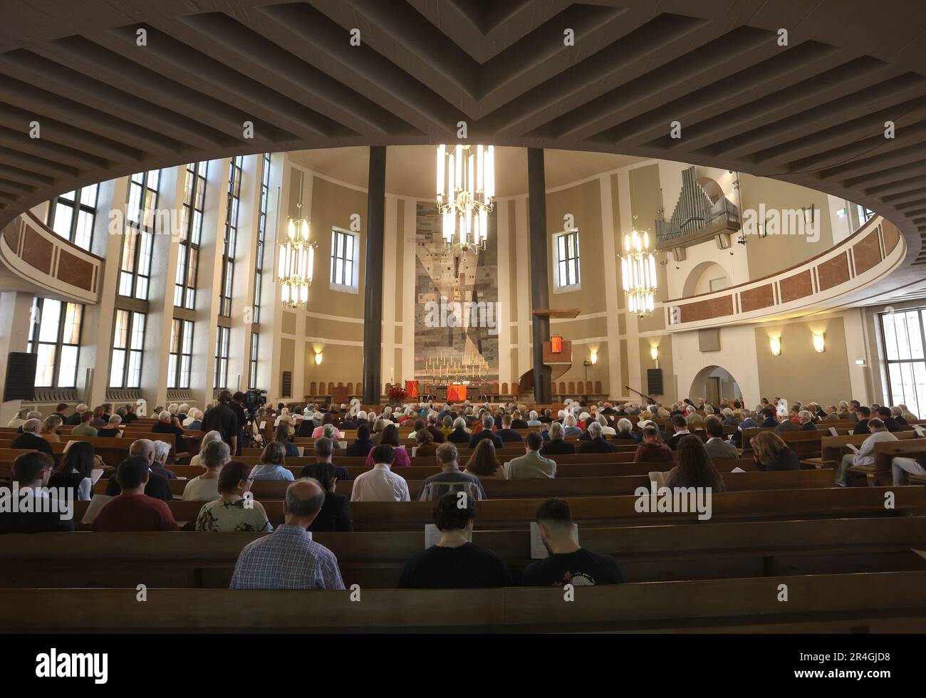 Munich, Germany. 28th May, 2023. Worshippers sit during a festive service at St. Matthew's ...