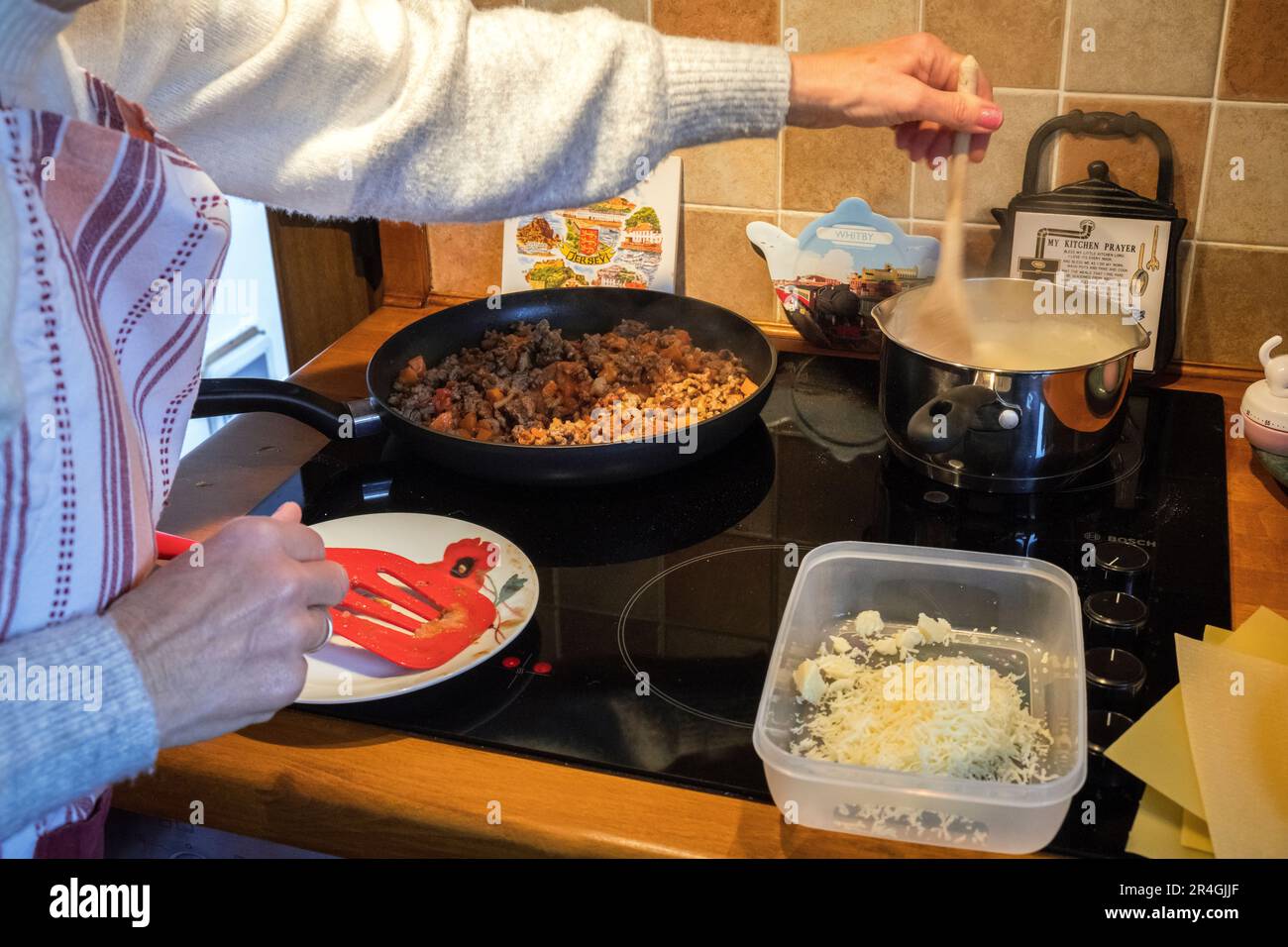 She busy cooking in the kitchen Stock Photo - Alamy