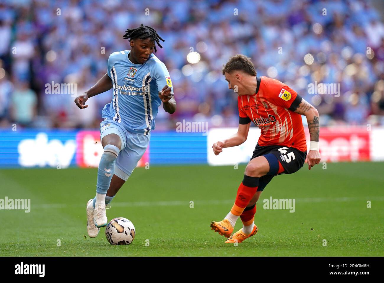 Coventry City's Brooke Norton-Cuffy (left) runs at Luton Town's Alfie ...